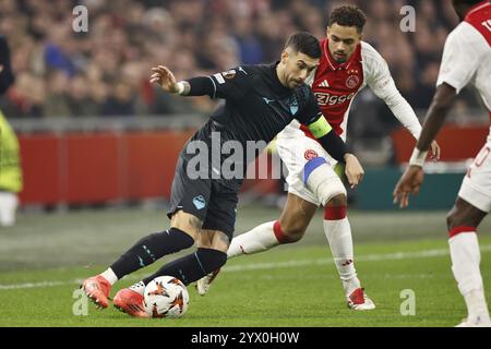 Mattia Zaccagni of SS Lazio,Devyne Rensch of AS Roma during the serie A ...