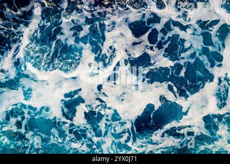 Areal shot of deep blue and rough sea with lot of sea spray.Blue ...
