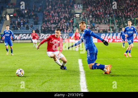 Angel Rodado of Wisla Krakow (L) and Mateusz Piszczelok of Poland seen ...