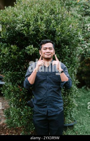 panoramic shot of handsome man pointing with finger at upset woman ...