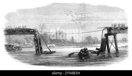A train crosses a large iron bridge shrouded in thick fog, with minimal ...