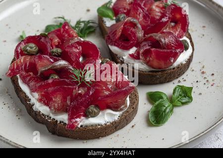 Sandwiches with gravlax salmon, cream cheese, capers, greens, breakfast ...