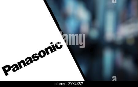 Panasonic logo is displayed on smartphone. Panasonic Holdings ...