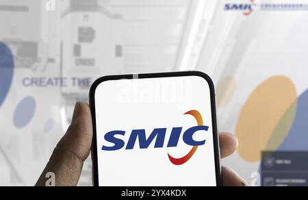 SMIC logo is displayed on smartphone. Semiconductor Manufacturing ...