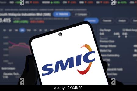 SMIC logo is displayed on smartphone. Semiconductor Manufacturing ...