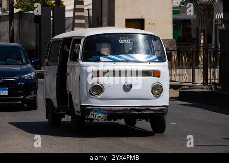 White VolksWagen VW minibus hop on hop off city taxi bus service on the ...