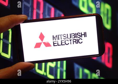 In this photo illustration, the Mitsubishi Electric logo is displayed ...
