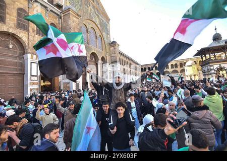 Syrians celebrate the new year after the ousting of Assad regime, in a ...