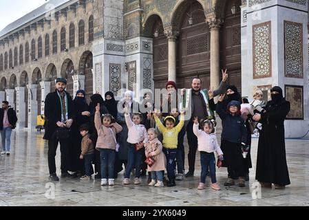 Syrians celebrate the new year in Damascus, Syria, Tuesday, Dec. 31 ...