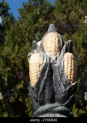 A small bunch of metal painted corncobs on the iconic cornstalk fence ...