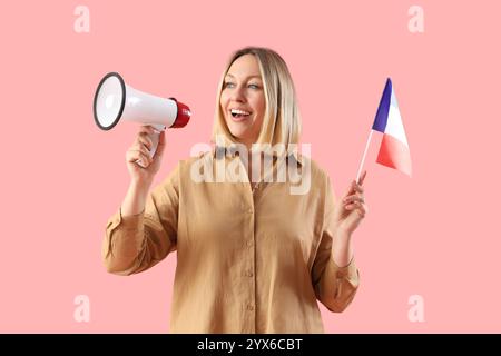 Female French language teacher with megaphone and flag on pink ...