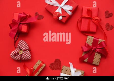 Frame made of gift boxes and hearts on red background, Valentine's Day ...
