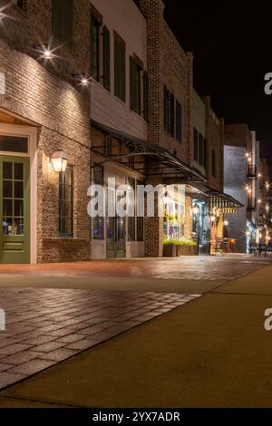 Brick storefronts with street lights at night Stock Photo - Alamy