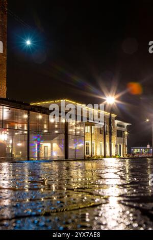 Brick storefronts with street lights at night Stock Photo - Alamy