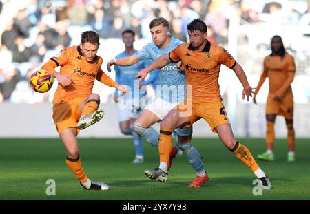 Hull City's Charlie Hughes (right) runs with the ball during the Sky ...