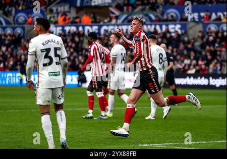 Sunderland's Daniel Ballard celebrates scoring their side's first goal ...