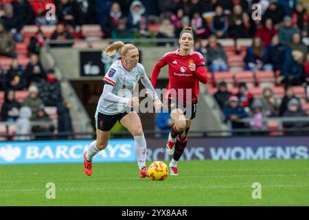 Ceri Holland (18 Liverpool) drives forward with the ball. Manchester ...