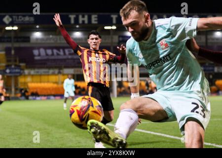 Aaron Drinan (23) of Swindon Town (centre) in action during the EFL ...