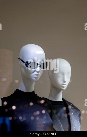 A vertical closeup of fashionable sunglasses with a colorful reflection ...