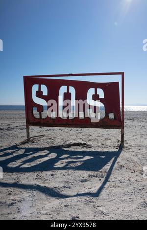 SOS artwork in Bombay Beach from the Biannual Exhibit Stock Photo - Alamy