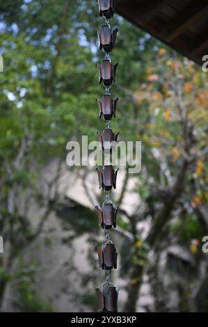 Kusari-doi or rain chain at a shrine in Nara, Japan, an alternative to ...