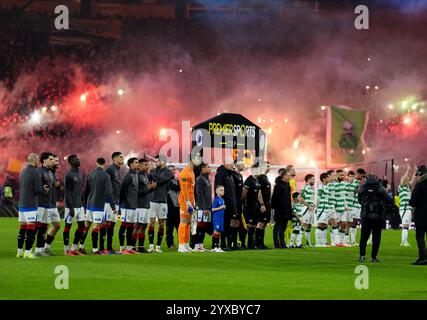 The players from both sides line up to sing the national anthem ahead ...