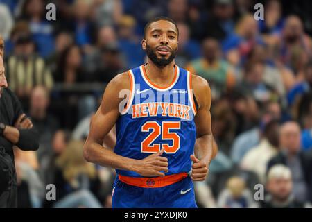 New York Knicks' Mikal Bridges, center, puts up a shot during the first ...
