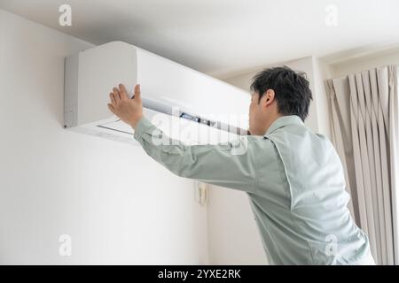 Air conditioner inspection Stock Photo - Alamy