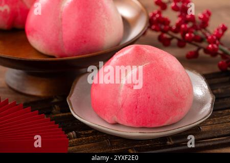 Pink Chinese peach birthday bun food named Longevity peach shoutao on ...