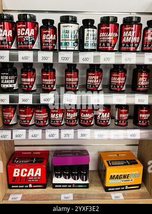 Creatine capsules. Sports supplements on bright paper background. Close ...