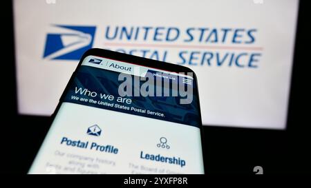 In this photo illustration, U.S. Postal Service logo is displayed on a ...