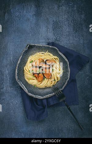 Spaghetti with mussels, without shell, pasta with peeled mussels, in ...