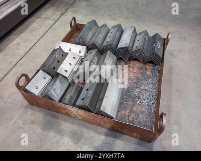 Metal cutting processing. Corner with holes. Warehouse of finished ...