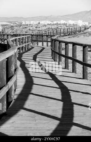 Wooden walkway to Arenales del Sol beach in a beautiful morning in ...