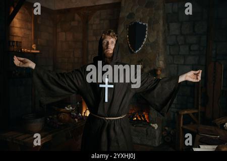 Medieval monk standing in cathedral Stock Photo - Alamy