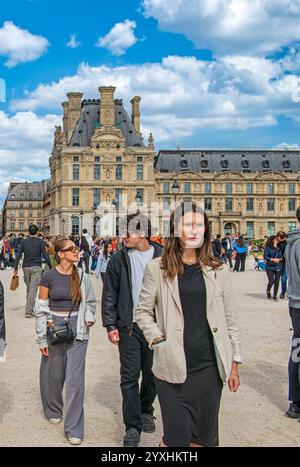 Hundreds of tourists at the Louvre in Paris, France, the new modern day ...