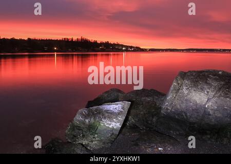 sunrise over calm water - Lysaker Stock Photo - Alamy