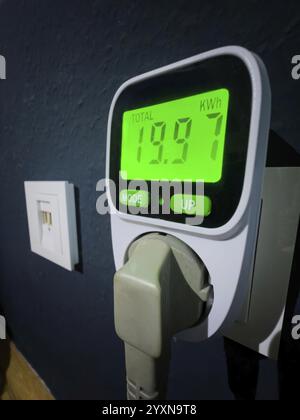 Measuring device for power consumption with display Stock Photo - Alamy