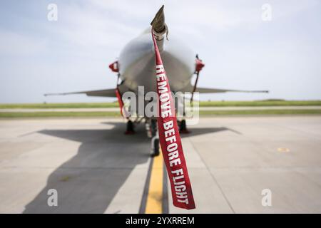Remove before flight ribbon safety on a fighter jet Stock Photo - Alamy
