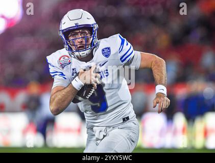 Memphis quarterback Seth Henigan runs a drill at the NFL football ...