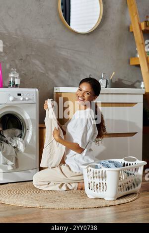 A young African American woman handles calls and manages tasks in a ...