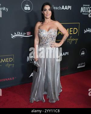 Courtney Tillia arrives at the 2024 UNTAMED Agency AAPI Holiday Charity ...