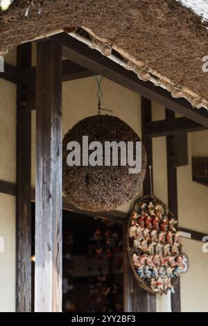 Traditional sake shop with cedar ball sign and shop entry curtain in ...