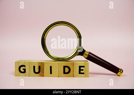 User Guide with wooden blocks alphabet letters and Magnifying glass and ...