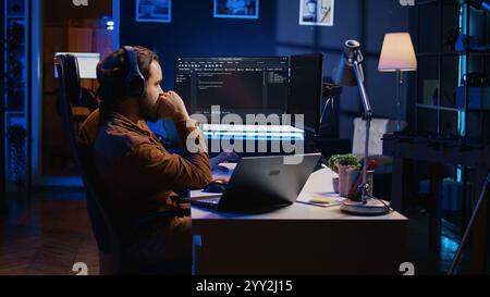 Frenzied programmer suffering from adhd illness, impatiently taping desk with fingers while ...