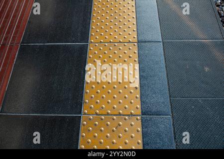 Crossroads with safe pedestrian crossings, floor tiles and path for the ...