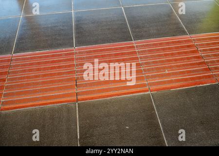 Crossroads with safe pedestrian crossings, floor tiles and path for the ...