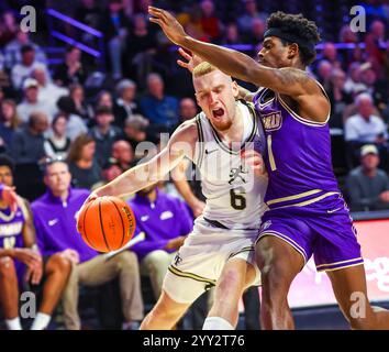James Madison guard Xavier Brown (1) looks to shoot over Marshall ...