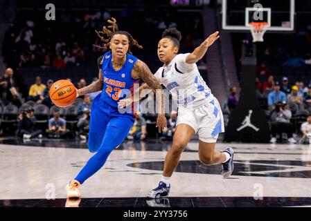 Florida guard Liv McGill. center, looks to pass the ball against Texas ...