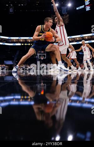 Michigan forward Will Tschetter (42) celebrates with fans after a 75-73 ...